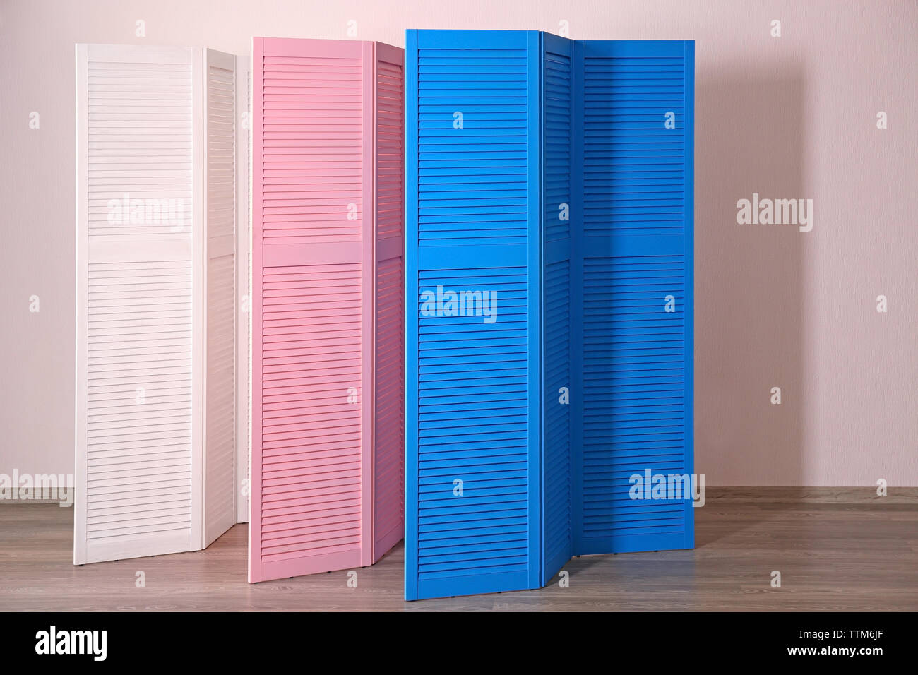 Color folding screens in room Stock Photo - Alamy