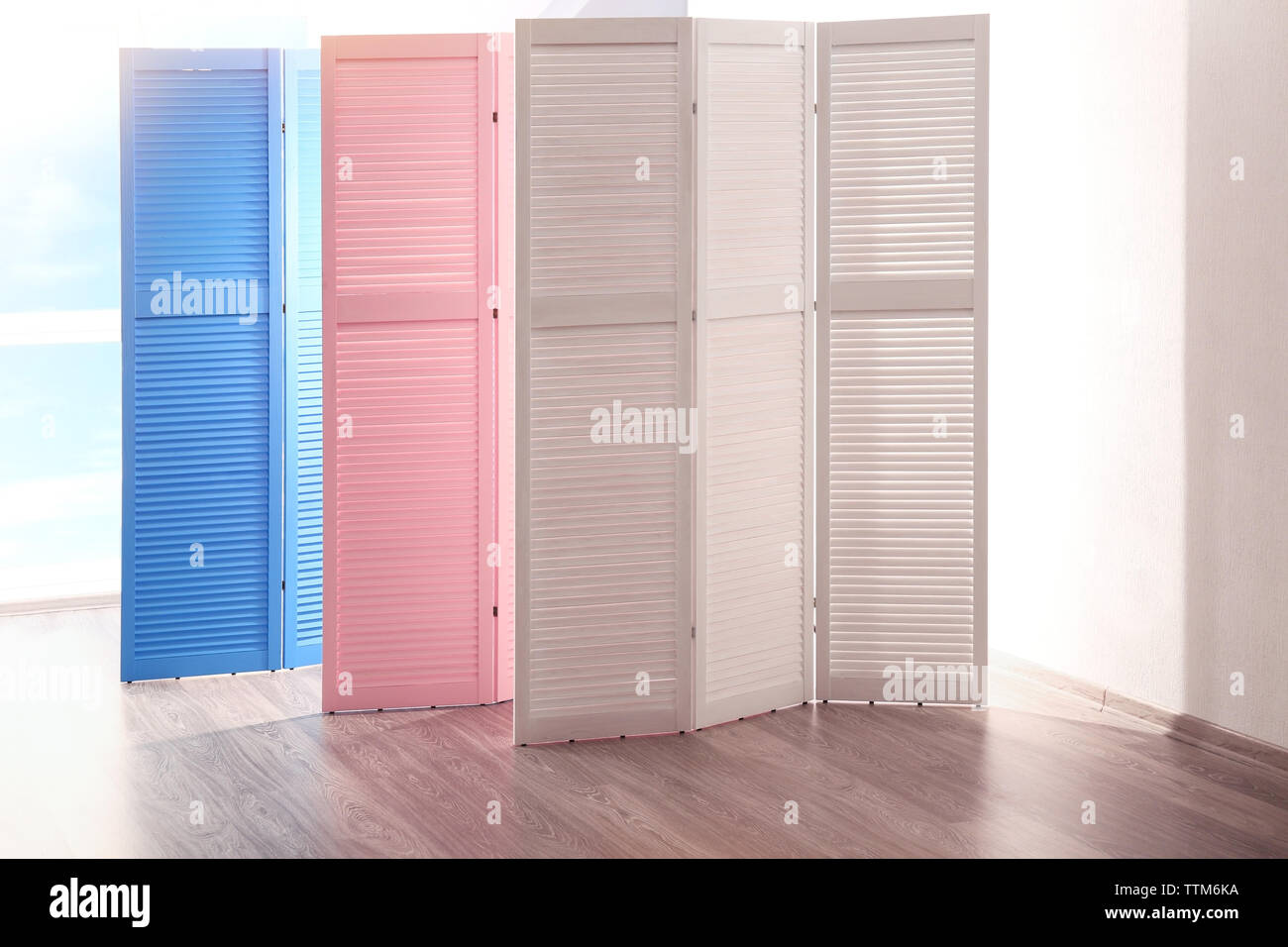 Color folding screens in room Stock Photo - Alamy