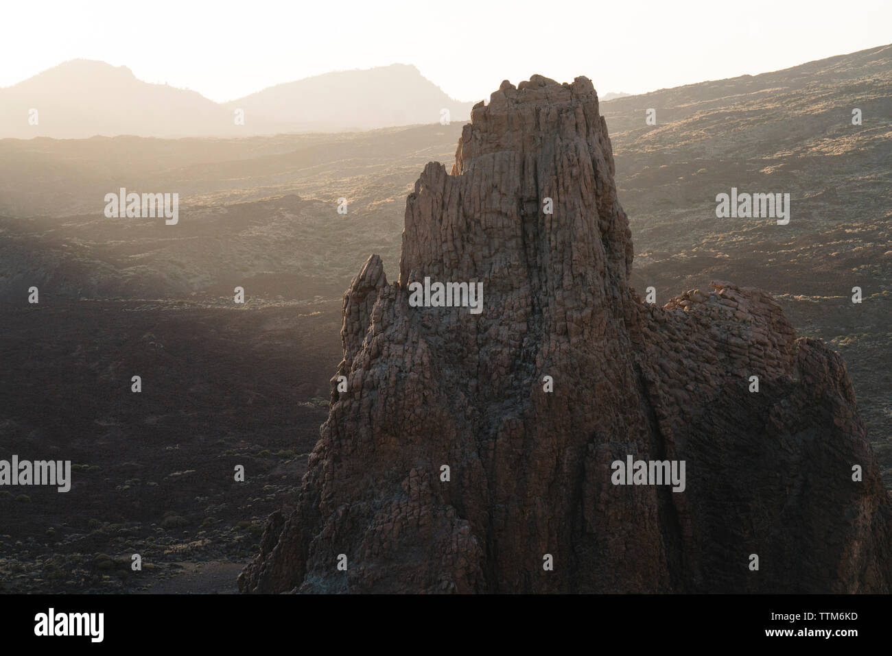 Scenic view of rock formation against landscape Stock Photo - Alamy