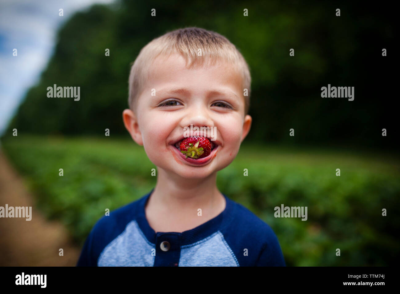 Cute happy smiling boy eating hi-res stock photography and images - Alamy