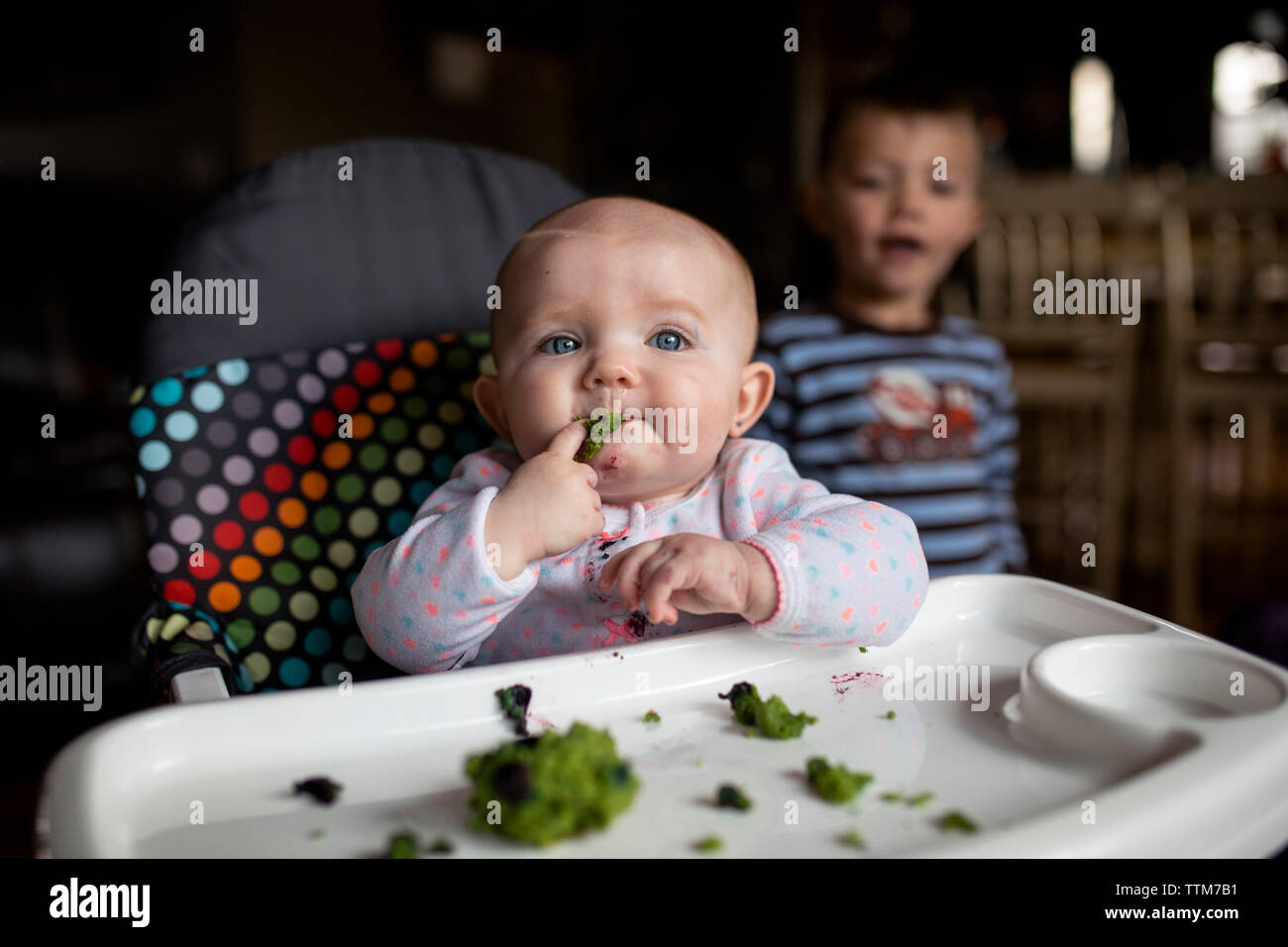 Boy girl sitting on chair hi-res stock photography and images - Alamy