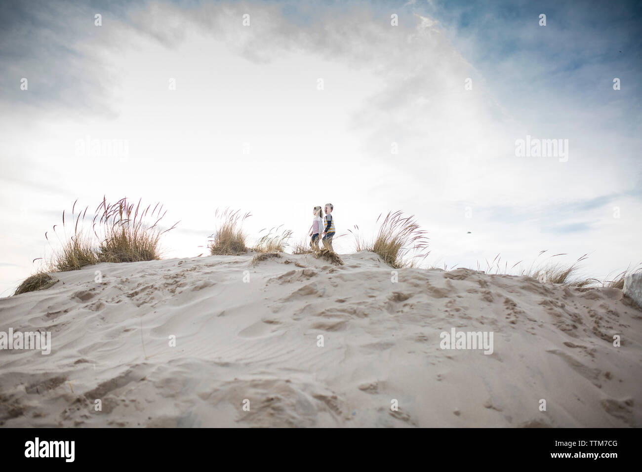 Standing against wind two people hi-res stock photography and images ...