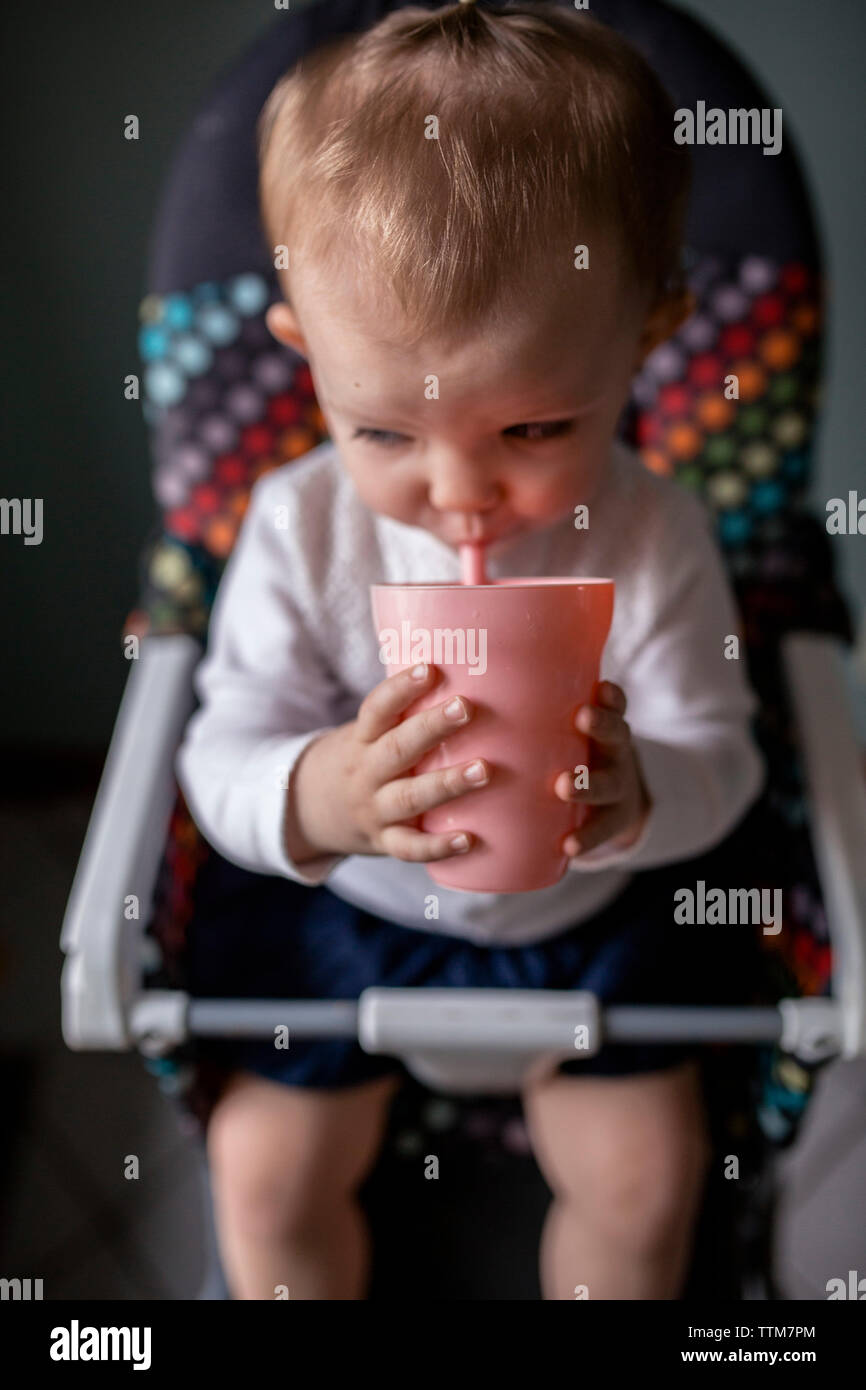 Toddler sitting on chair hi-res stock photography and images - Alamy