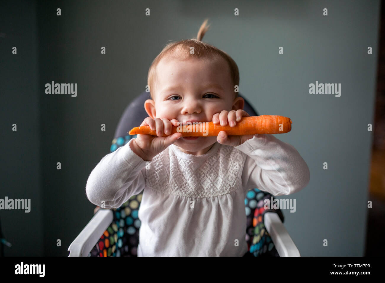 Baby eating carrot hi-res stock photography and images - Alamy