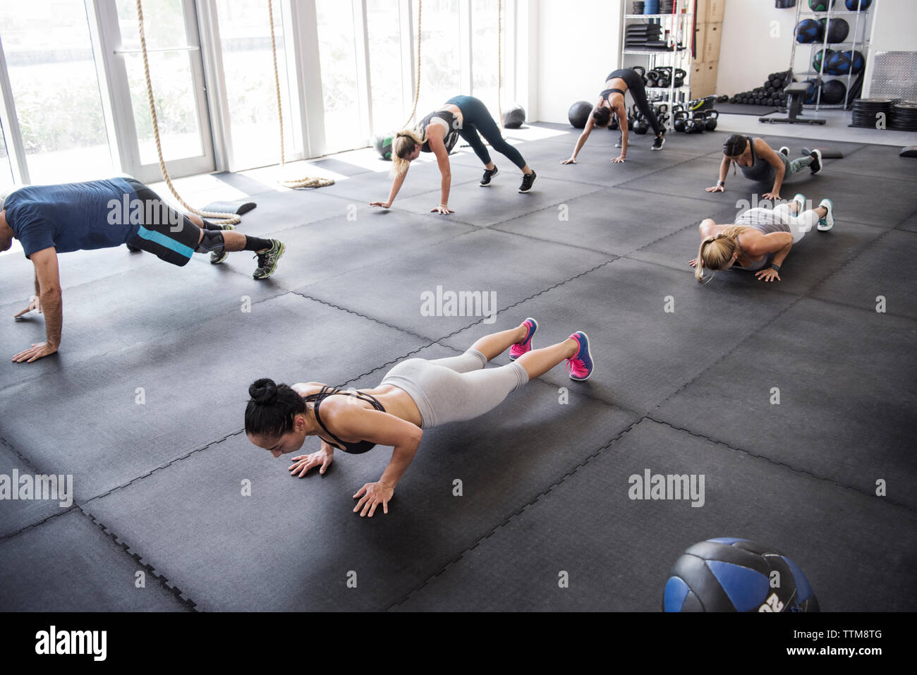 High angle view of athletes doing push-ups in crossfit gym Stock Photo ...