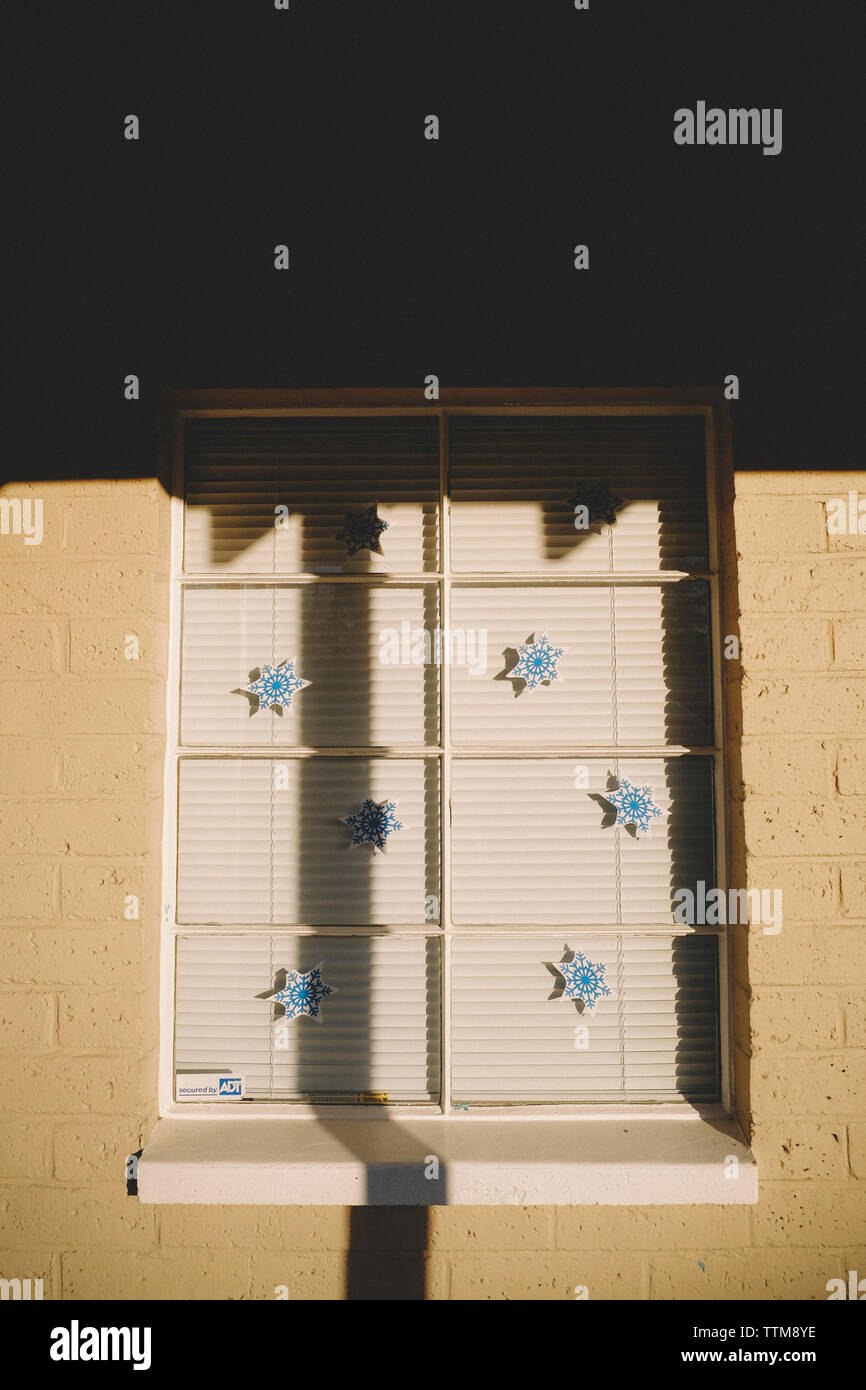 Sunlight falling on wall with closed window Stock Photo - Alamy