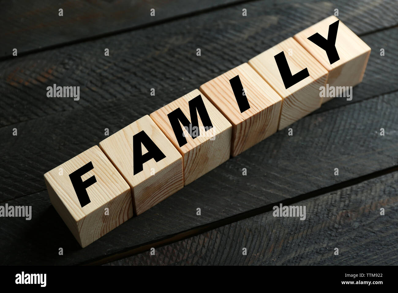 Word FAMILY on dark grey background Stock Photo - Alamy