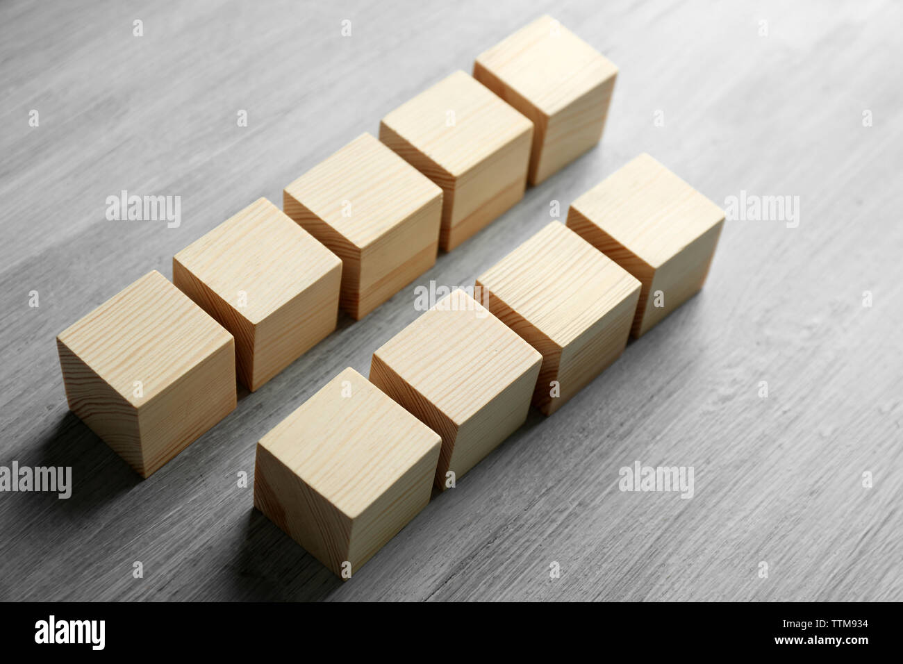 Wooden cubes on light grey background Stock Photo - Alamy