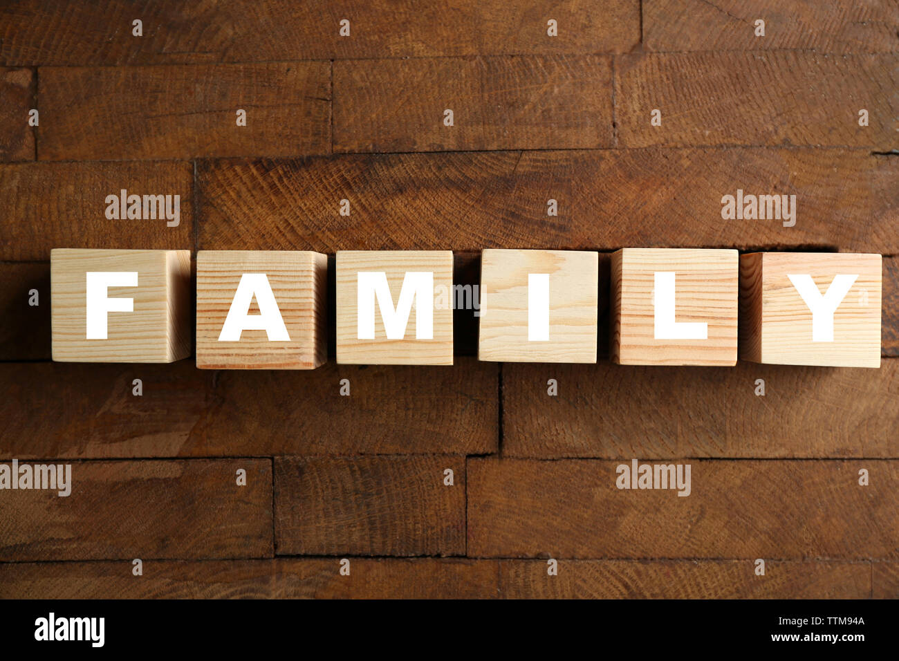 Word FAMILY on wooden background Stock Photo - Alamy