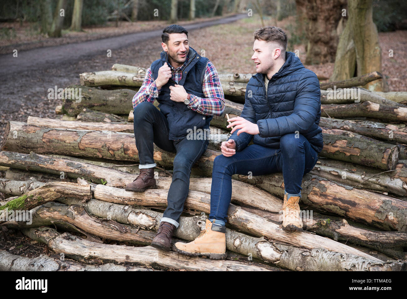 Two male friends talking outdoors hi-res stock photography and images ...
