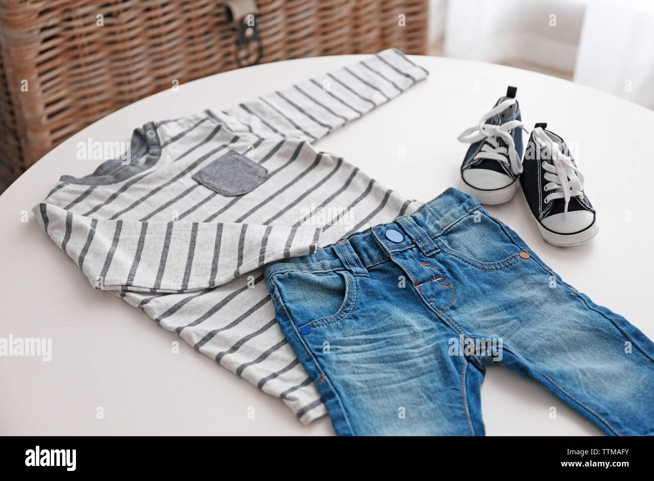 Baby clothes on a table hi-res stock photography and images - Alamy