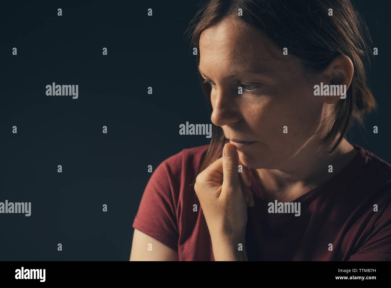 Low key portrait of depressed sad woman Stock Photo - Alamy