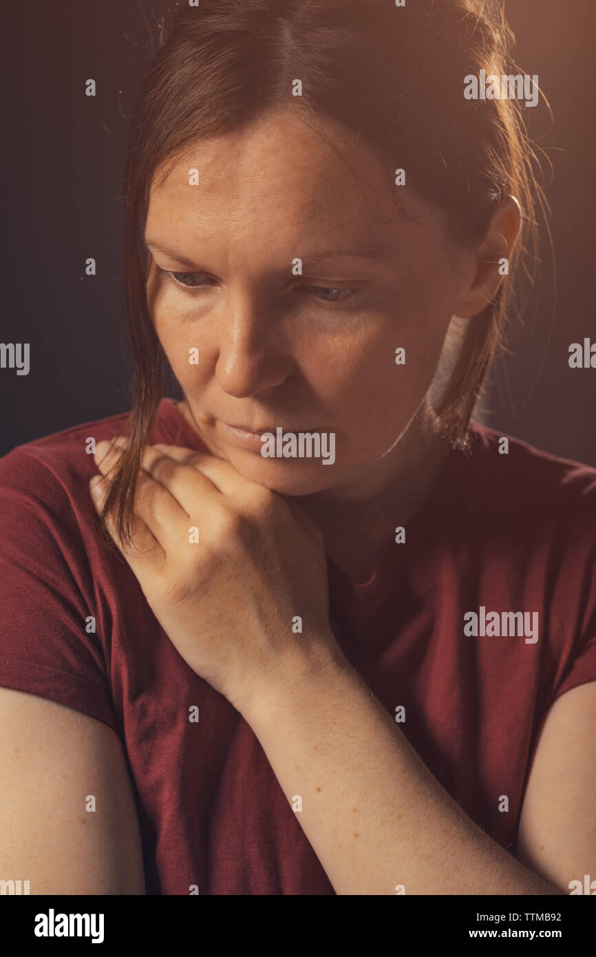 Low key portrait of depressed sad woman Stock Photo - Alamy