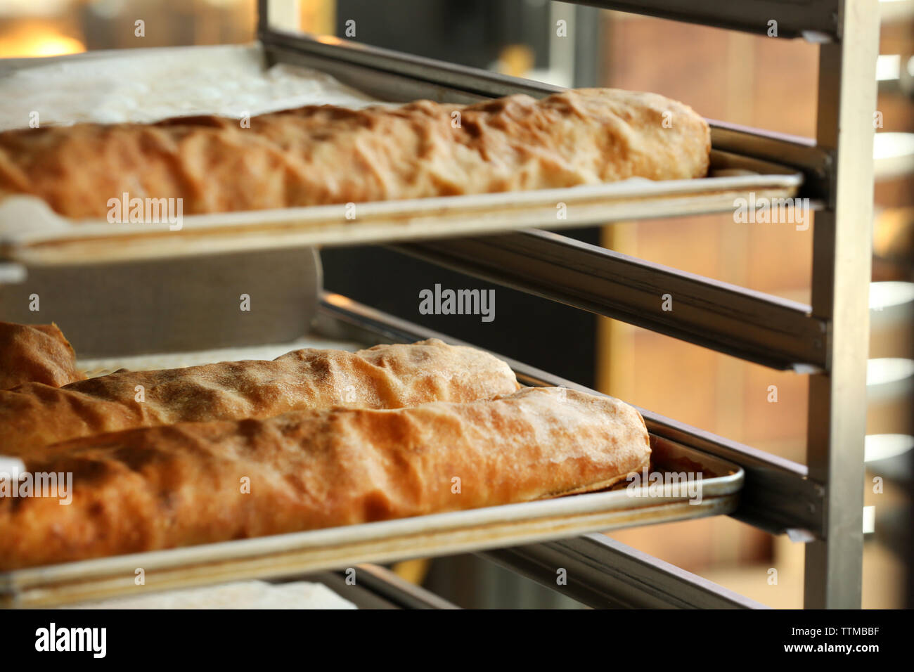 Strudels on shelving in bakery Stock Photo - Alamy