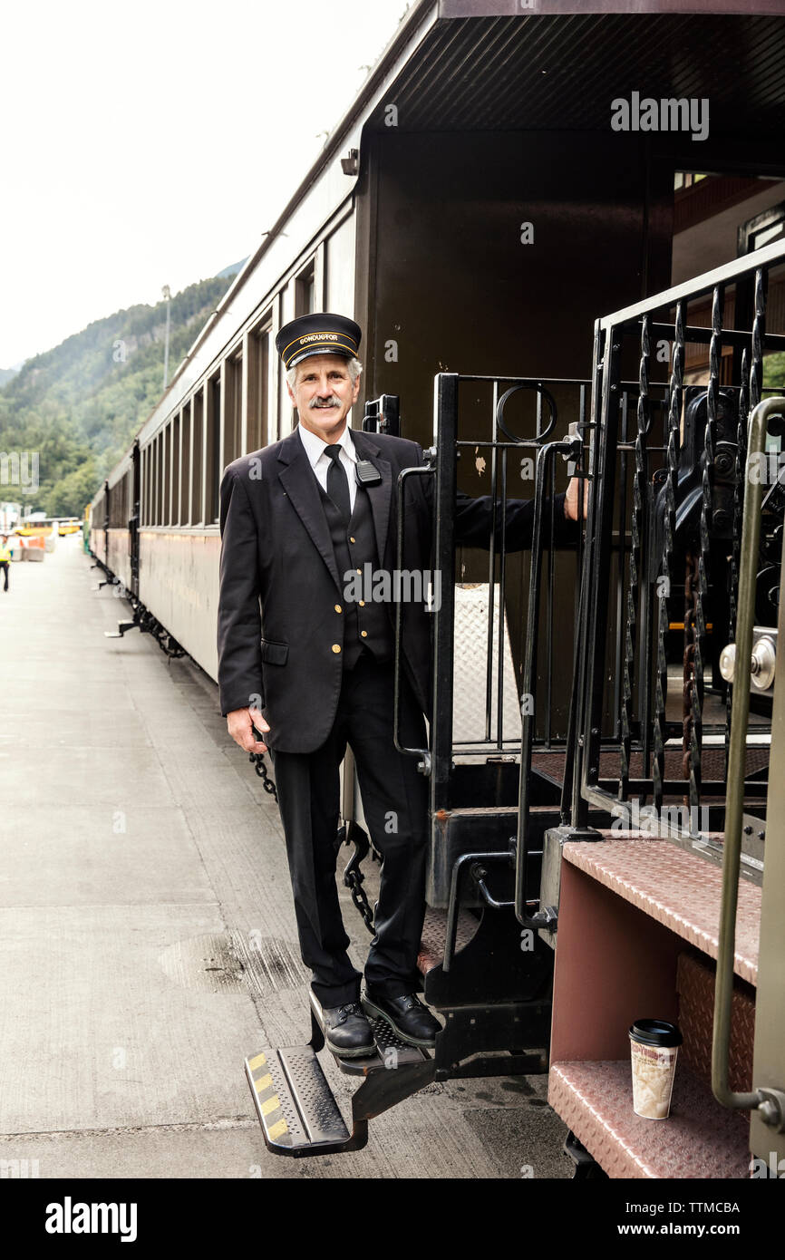 USA, Alaska, Sitka, one of the train conductors aboard the White Pass ...