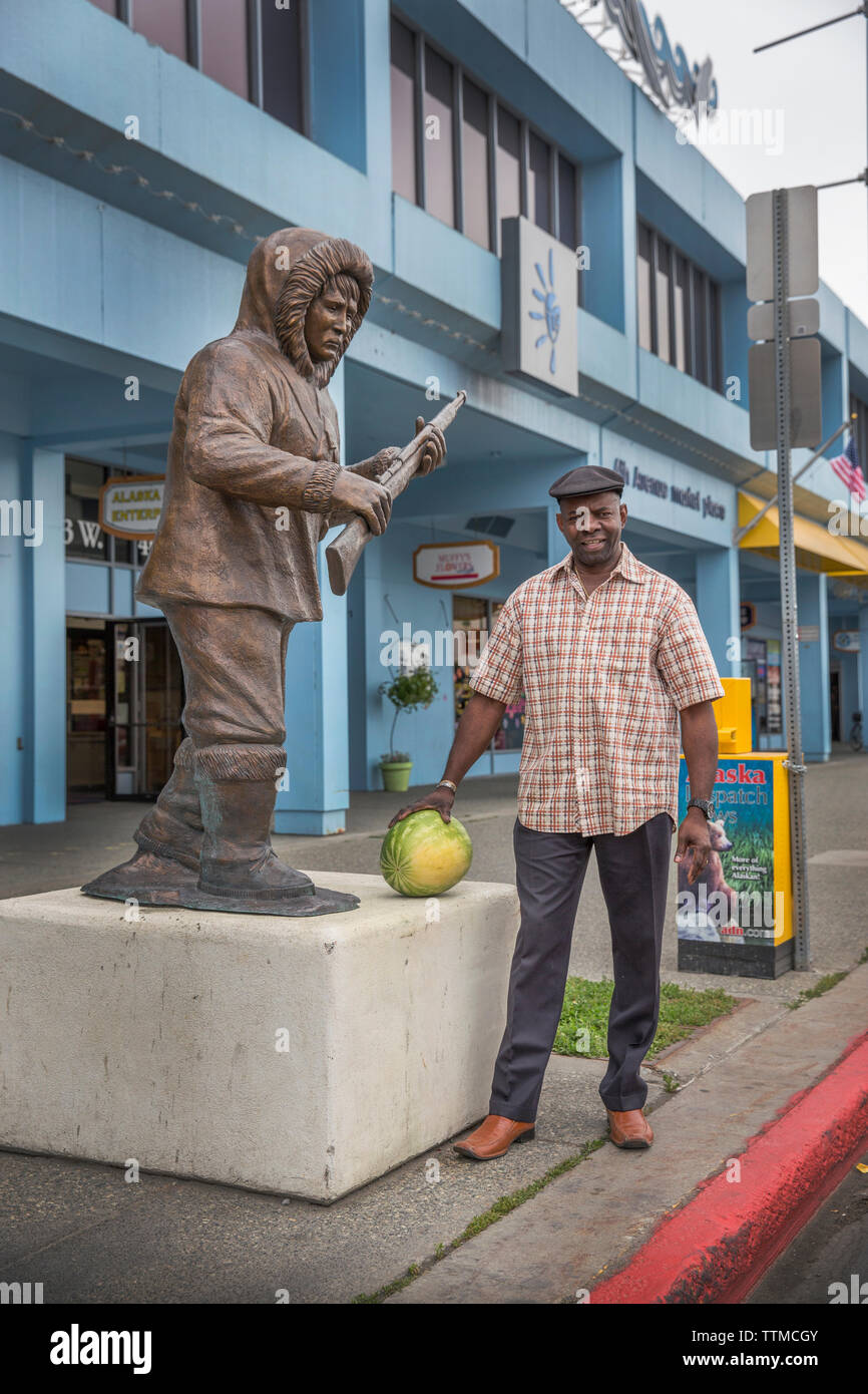 USA, Alaska, Anchorage, a local man walks through the streets of ...