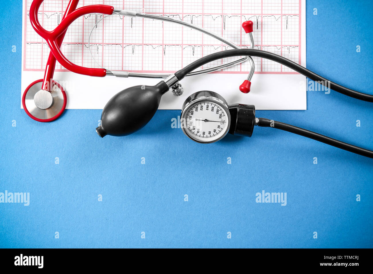 Medical concept. Medical manometer and a stethoscope on a blue ...