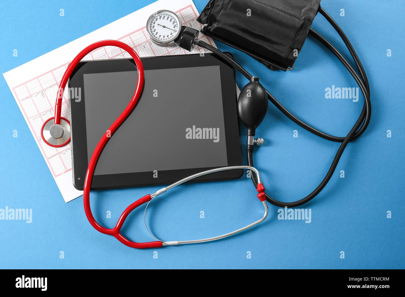 Medical concept. Medical manometer, tablet and a stethoscope on a blue ...