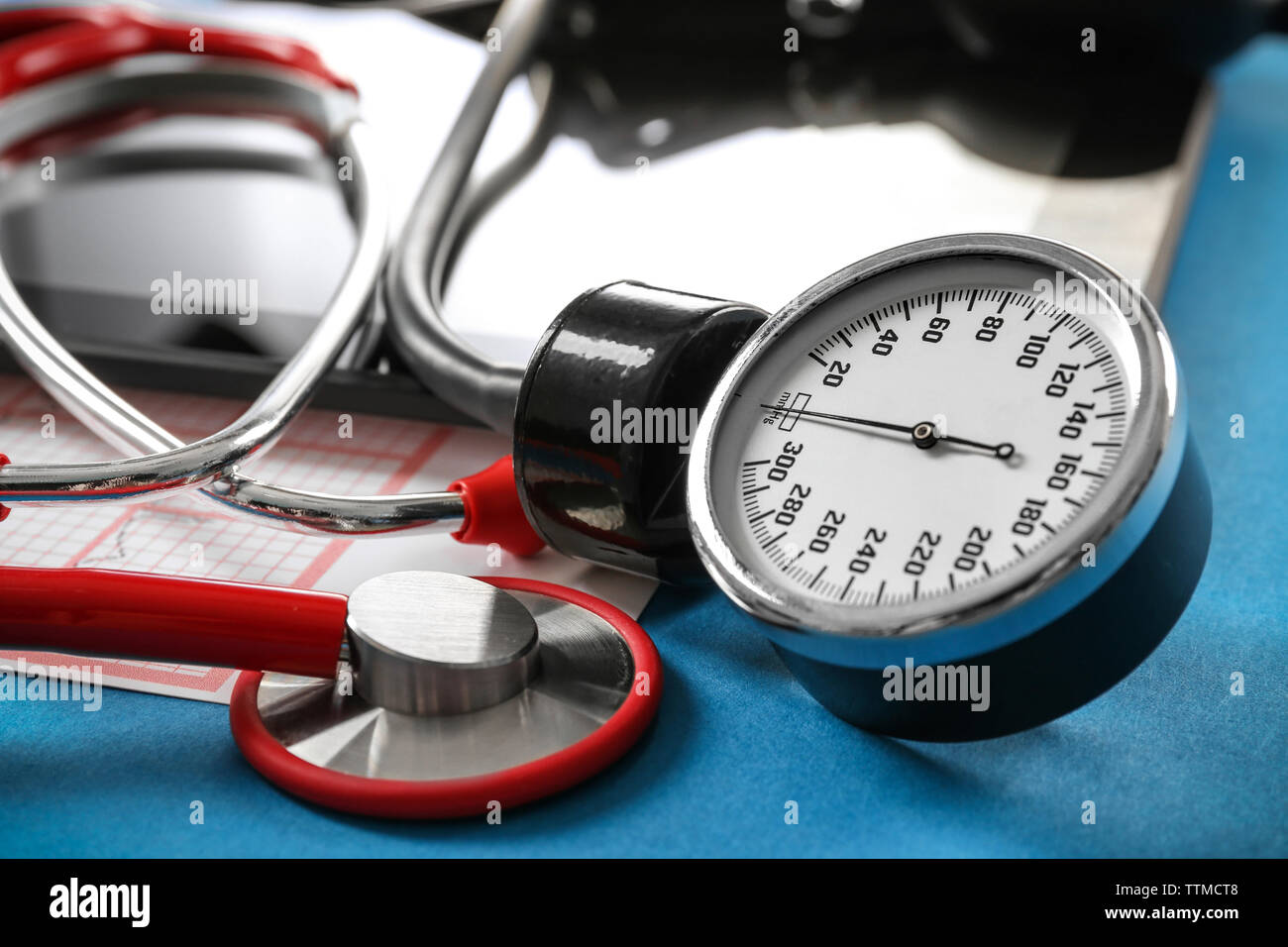 Medical concept. Medical manometer and a stethoscope on a blue ...