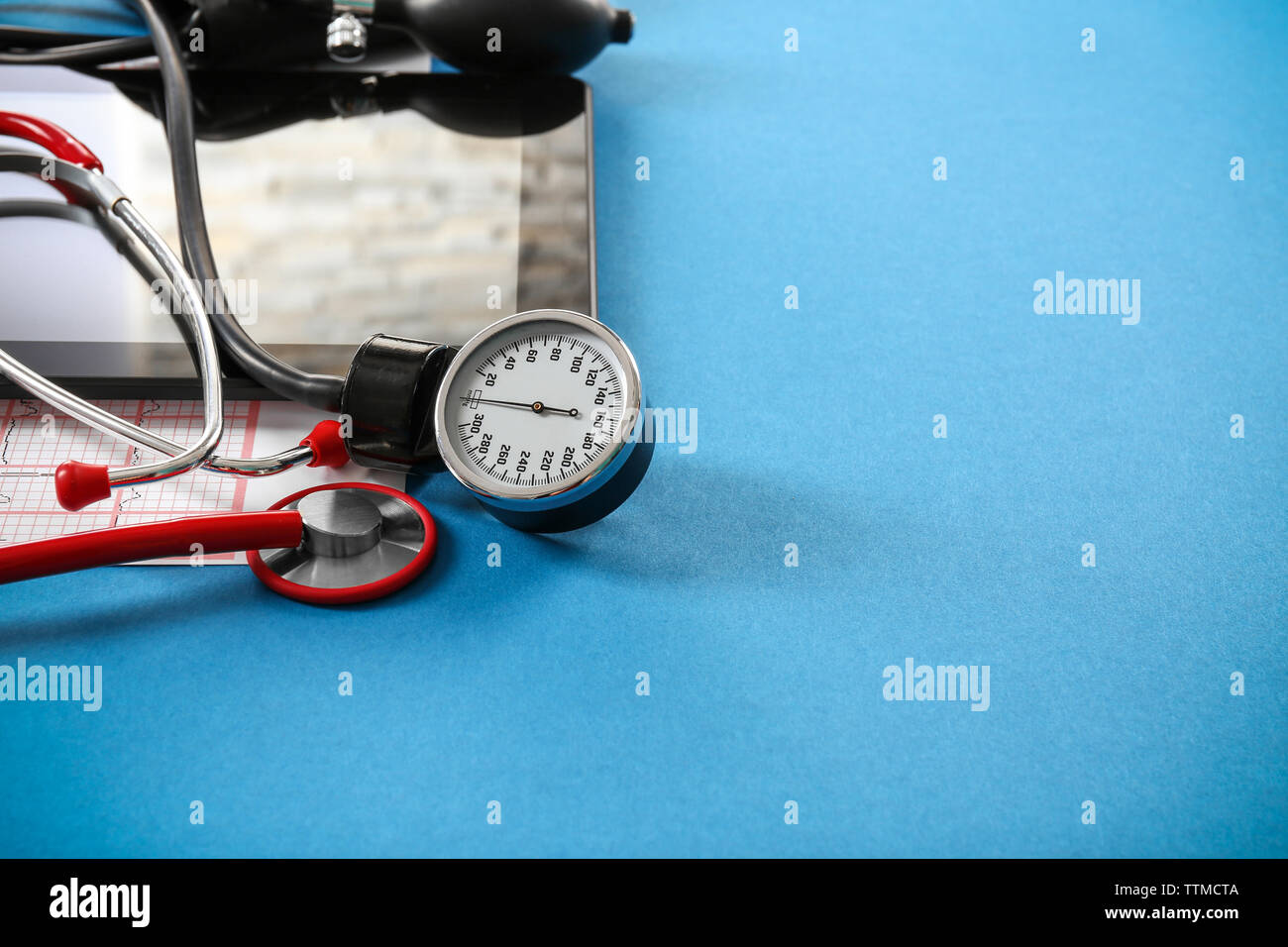 Medical concept. Medical manometer and a stethoscope on a blue ...