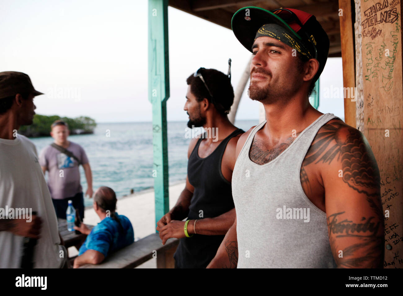 BELIZE, Caye Caulker, Local Boys hang out at the Lazy Lizard Bar Stock ...