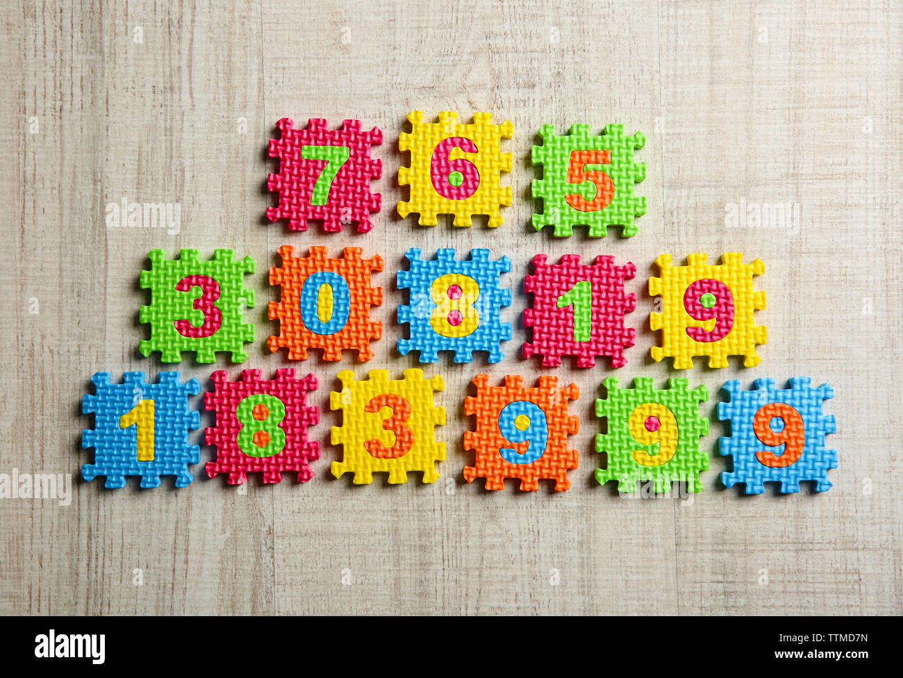 Colorful numbers on wooden table Stock Photo - Alamy