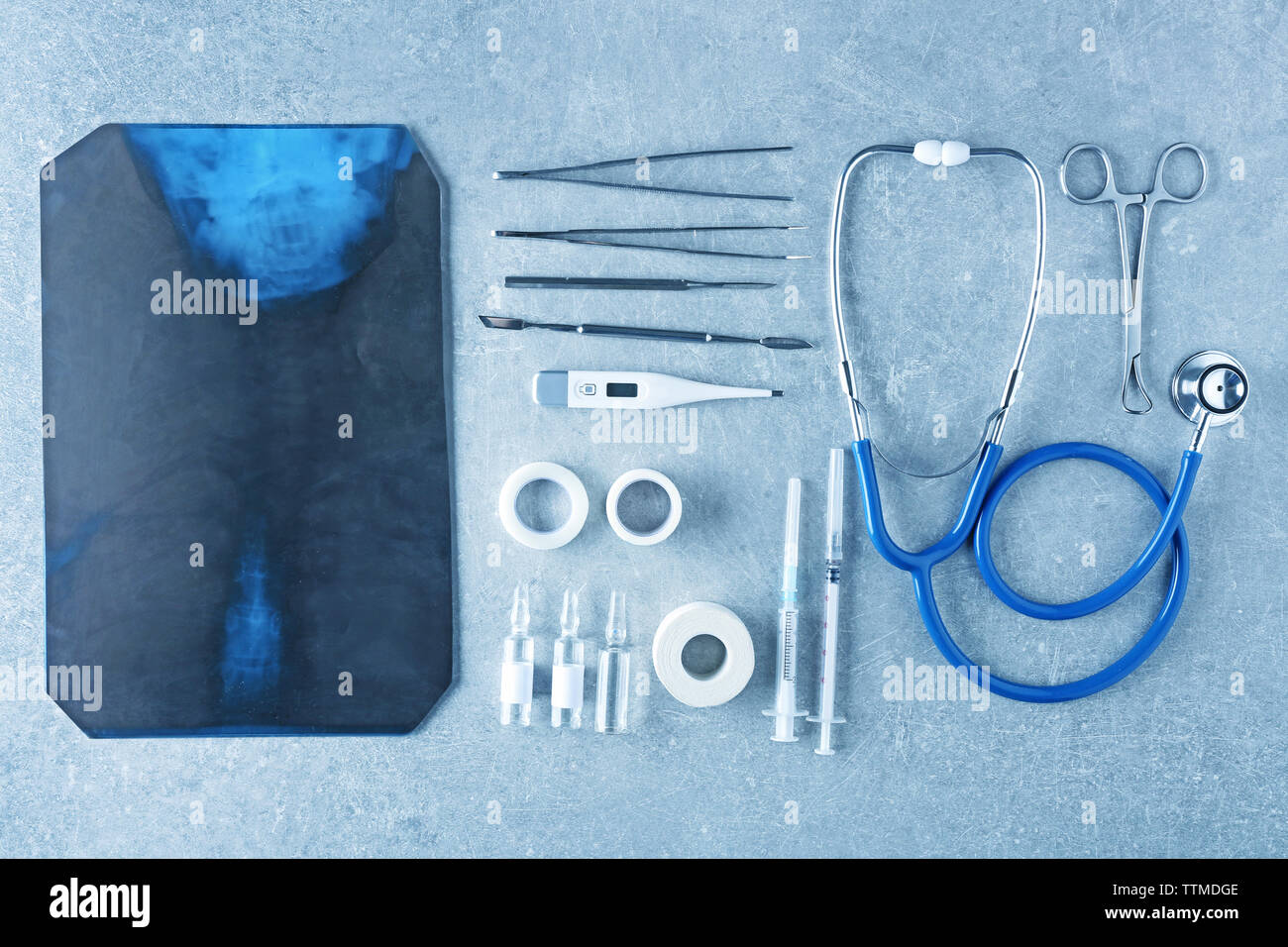 Medical tools set with x-ray on gray background Stock Photo - Alamy