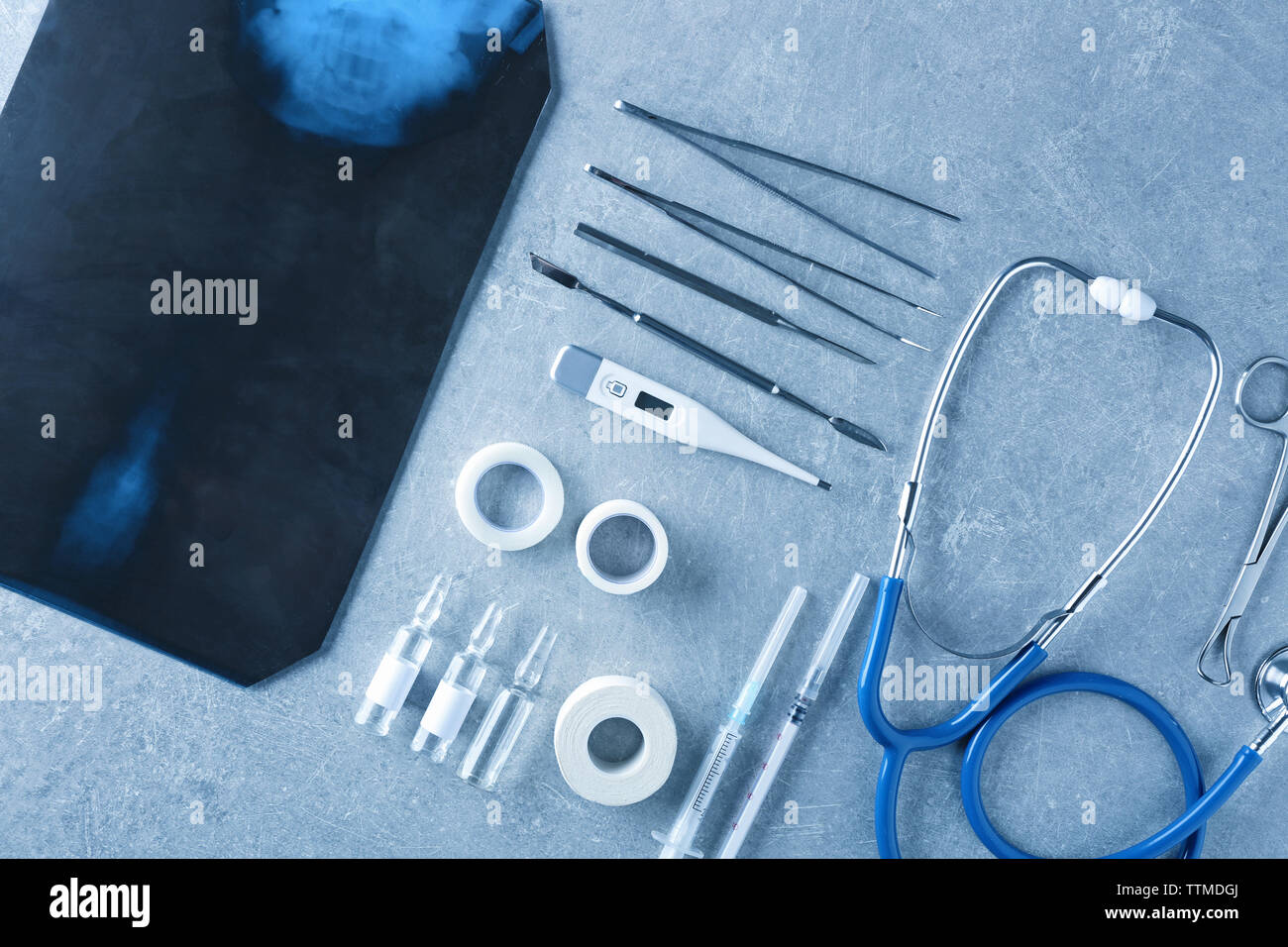 Medical tools set with x-ray on gray background Stock Photo - Alamy