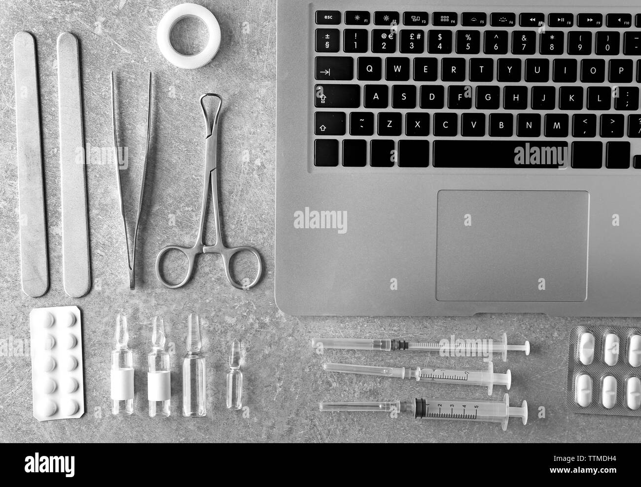 Medical tools set with laptop on gray background Stock Photo - Alamy