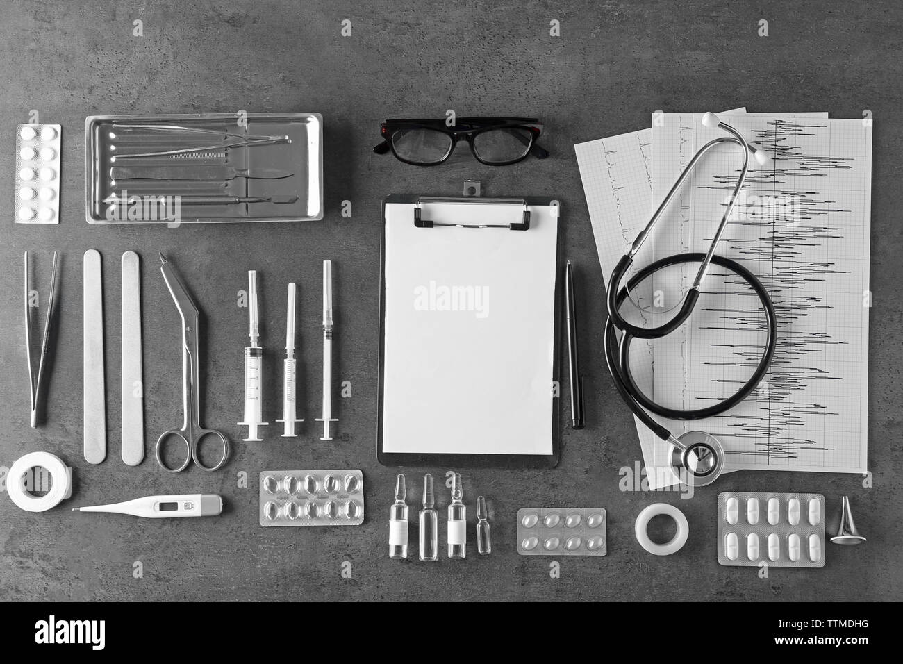 Medical tools set on dark gray background Stock Photo - Alamy