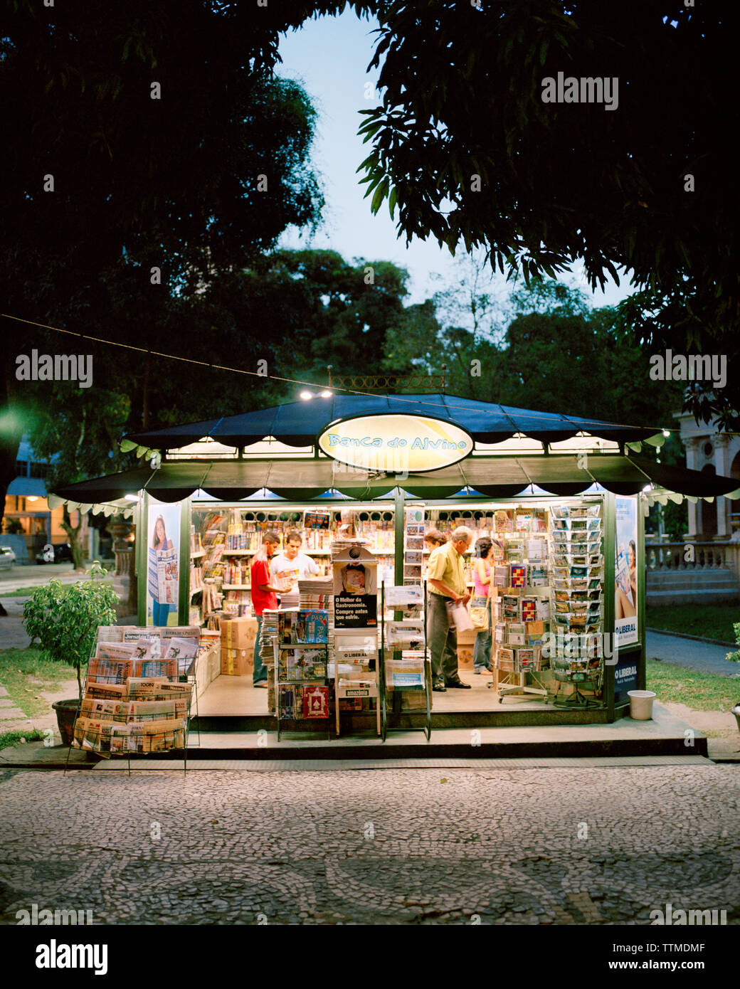 Brazil, Belem, South Africa, people standing in shop at dusk Stock ...
