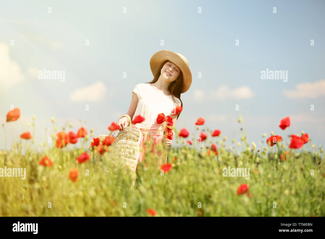 Beautiful girl in poppy field Stock Photo - Alamy