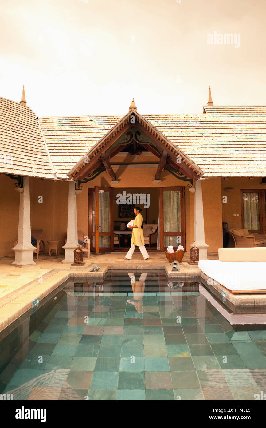 MAURITIUS, Wolmar, an employee suplies a luxury villa with fresh towels ...