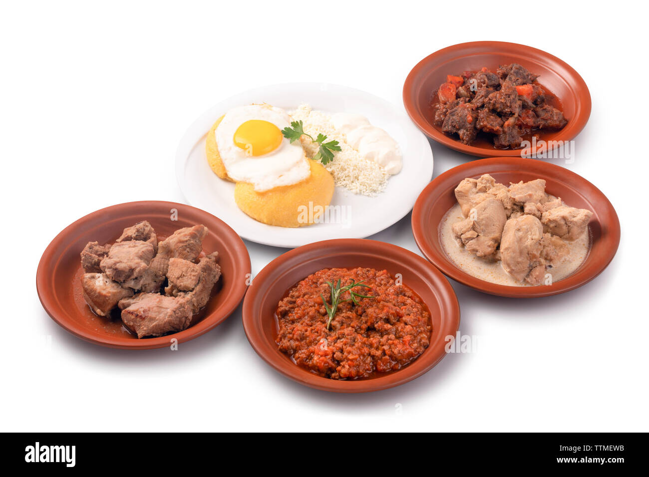 Traditional dish in Moldova. Hominy served with meat, eggs and cheese ...