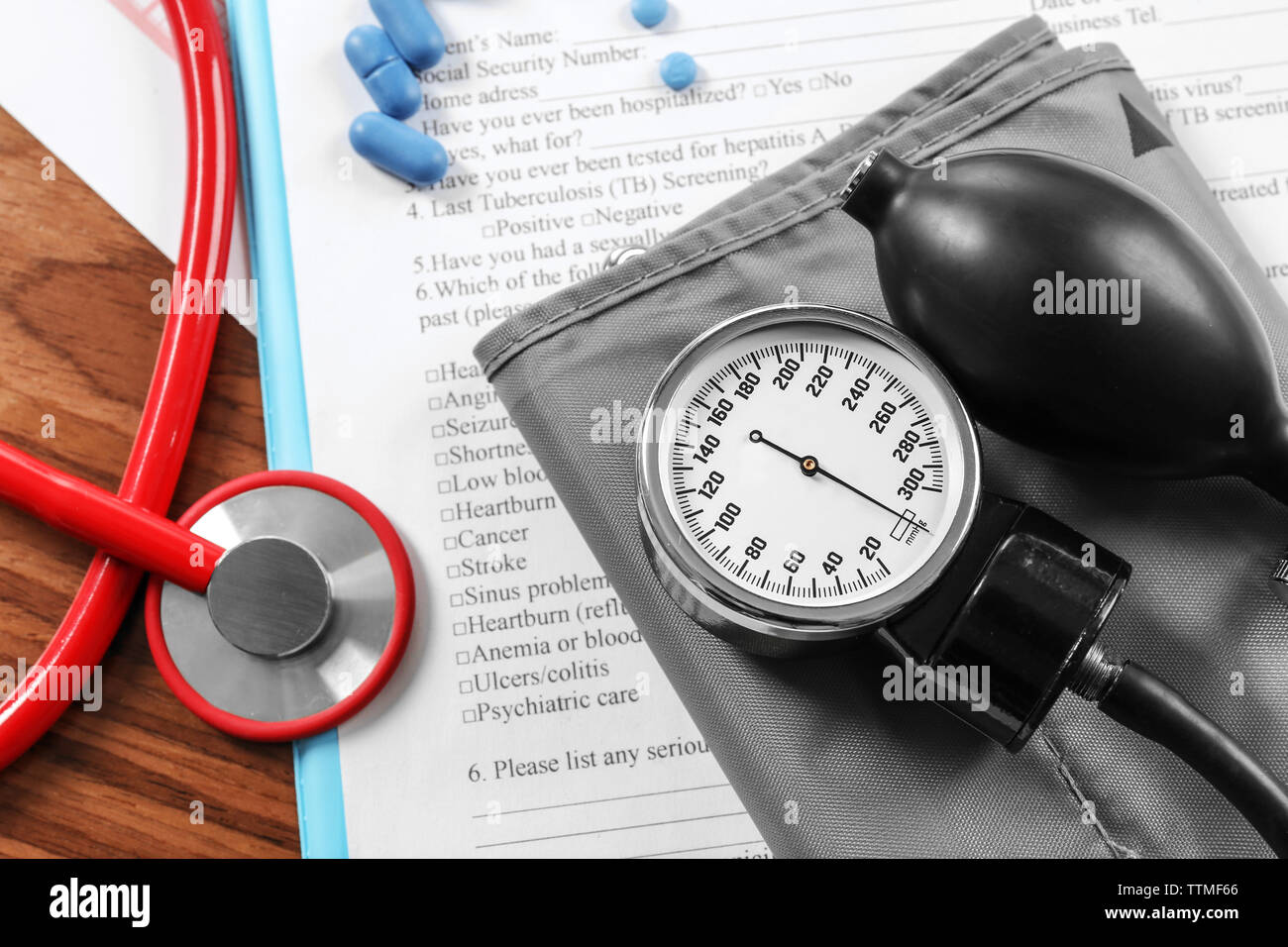 Medical concept. Medical stethoscope and manometer with patient history ...