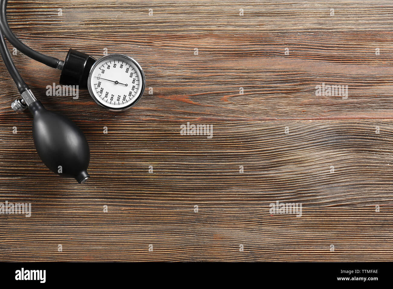 Medical manometer on a wooden background Stock Photo - Alamy