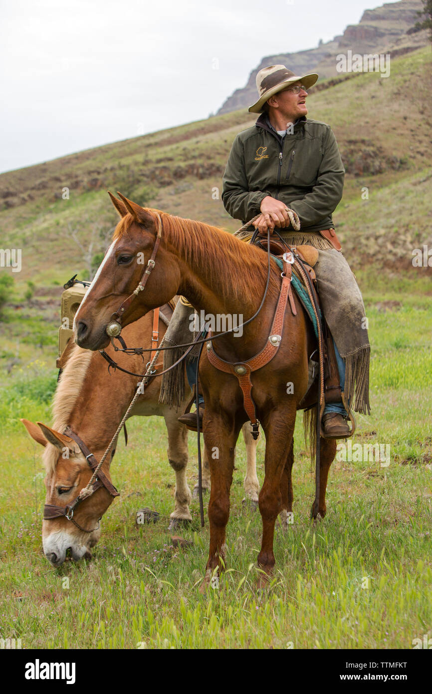 USA, Oregon, Joseph, portrait of cowboy Cody Ross in the canyon up Big ...