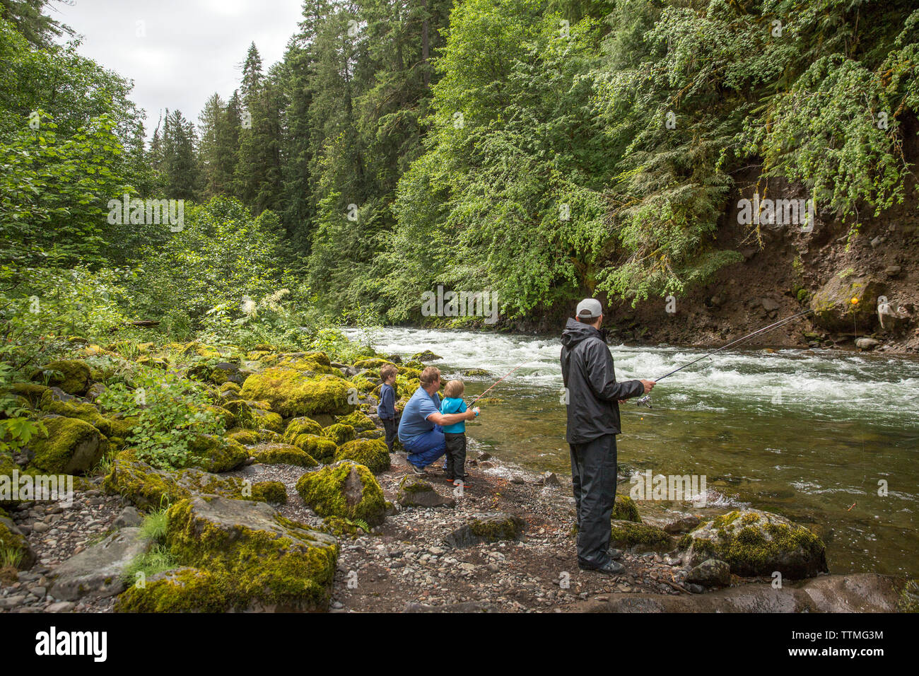 USA, Oregon, Santiam River, Brown Cannon, young boys learning how to ...