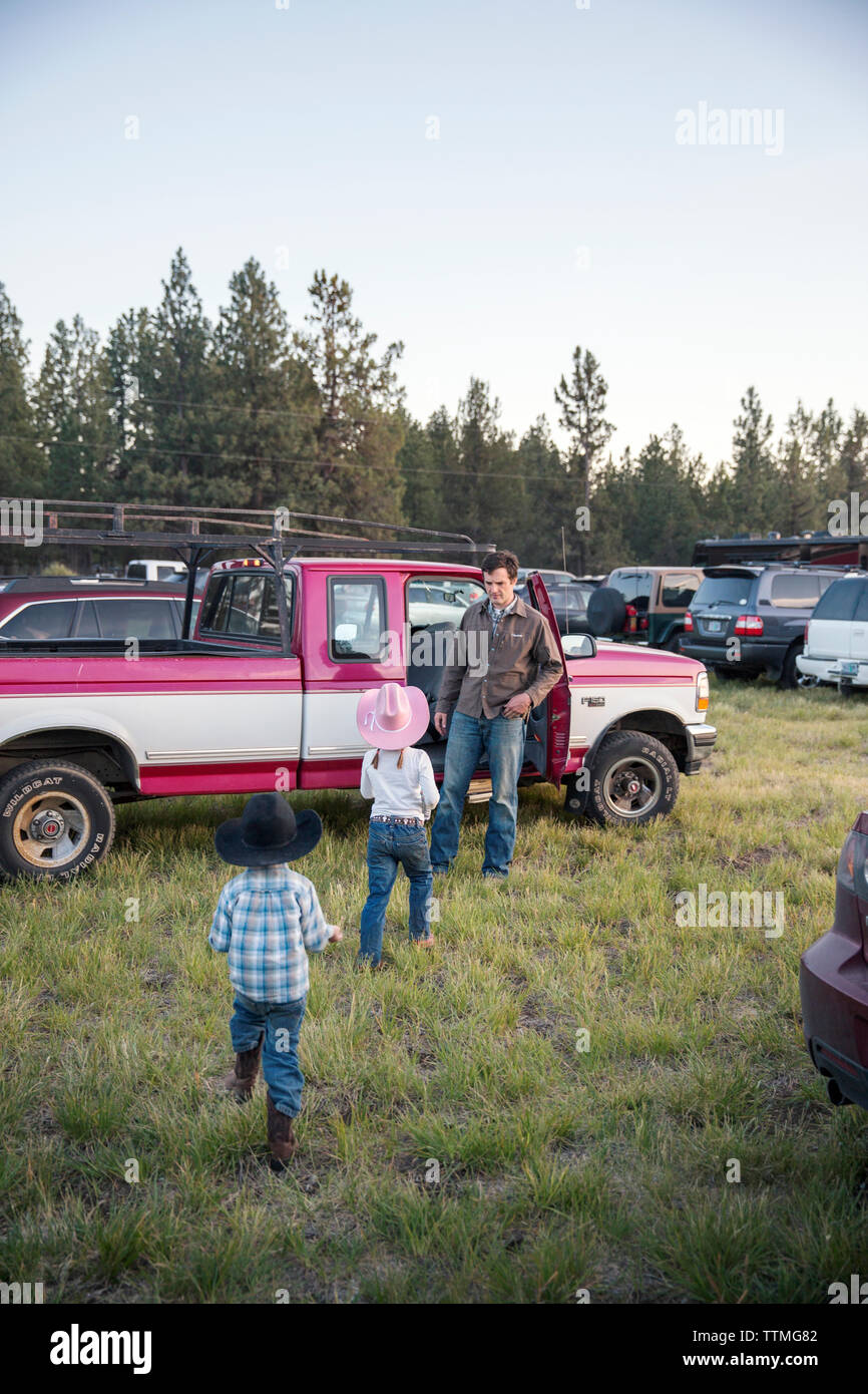 USA, Oregon, Sisters, Sisters Rodeo, children playing on the grounds of ...