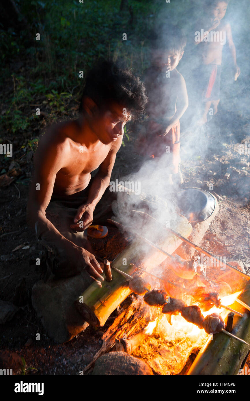PHILIPPINES, Palawan, Barangay region, chicken being prepared and ...