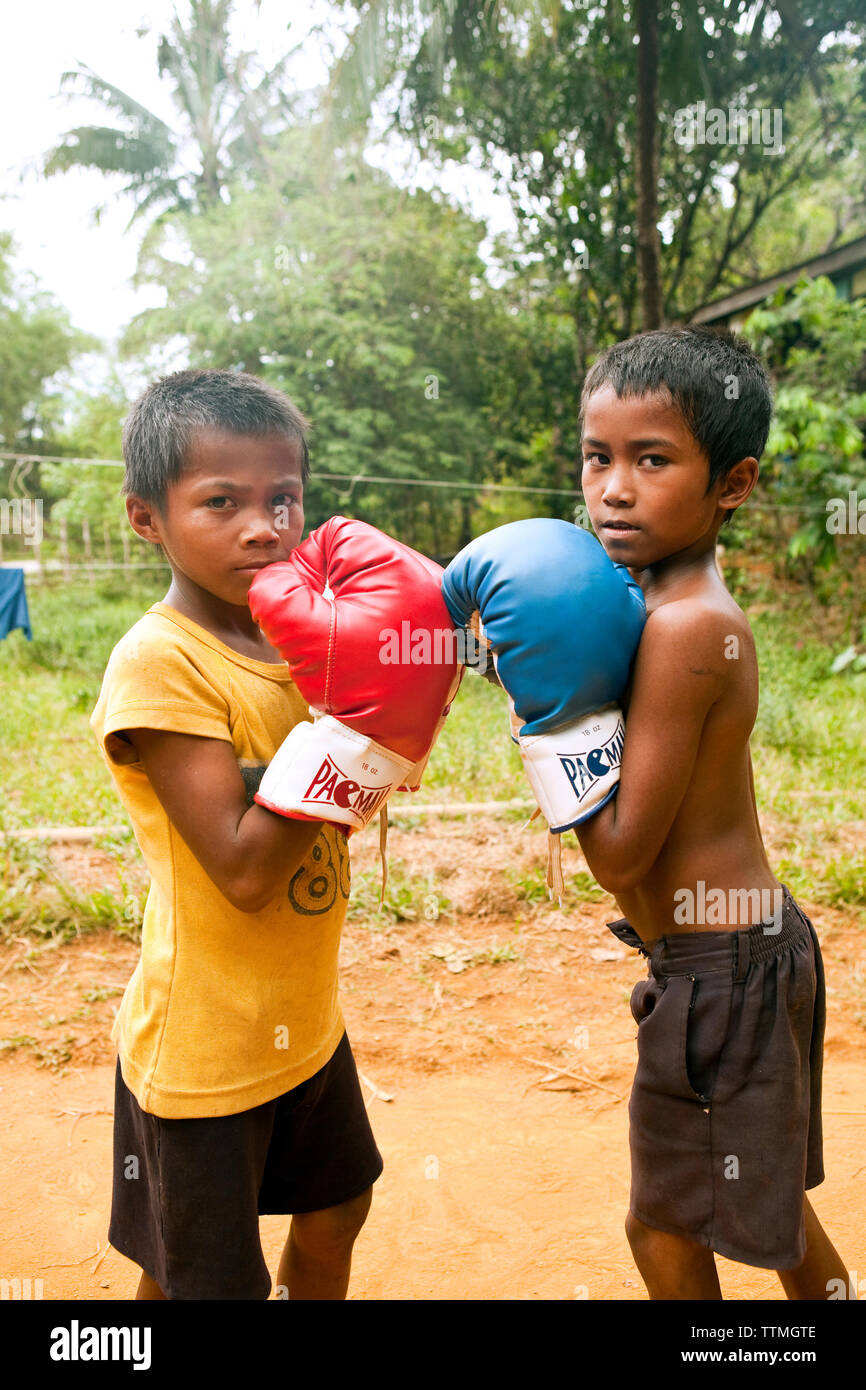 PHILIPPINES, Palawan, Sabang, young boys practice their boxing in the ...