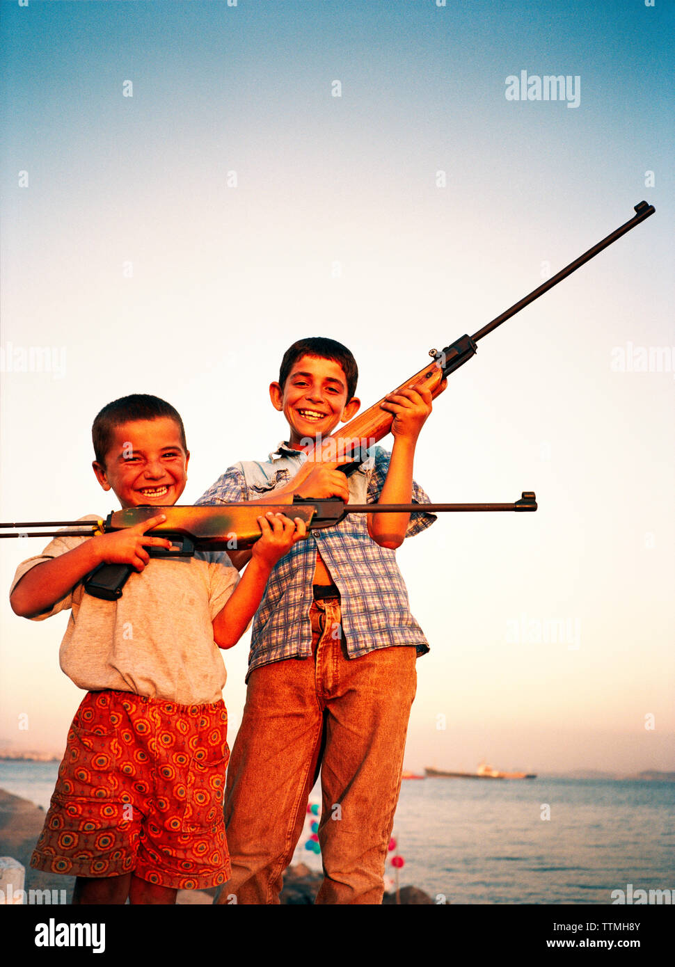 TURKEY, Istanbul, boys play with their guns by the Sea of Marmara, near ...