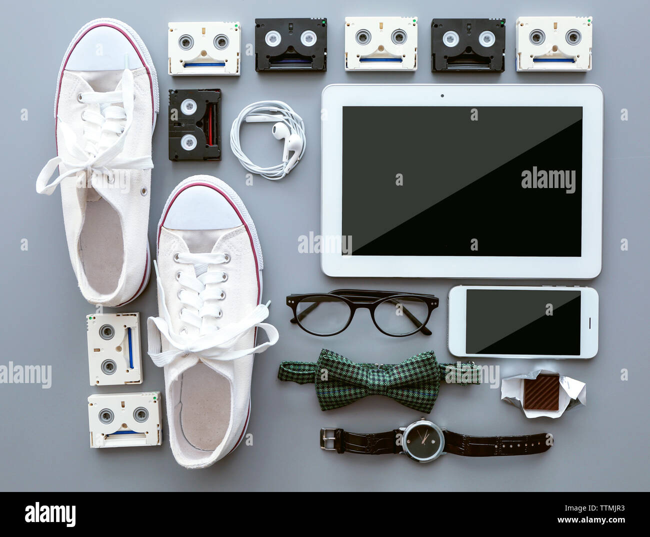 Top view of clothing and personal accessory on the grey background ...