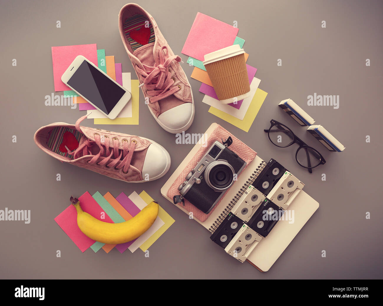 Top view of clothing and personal accessory on the grey background ...