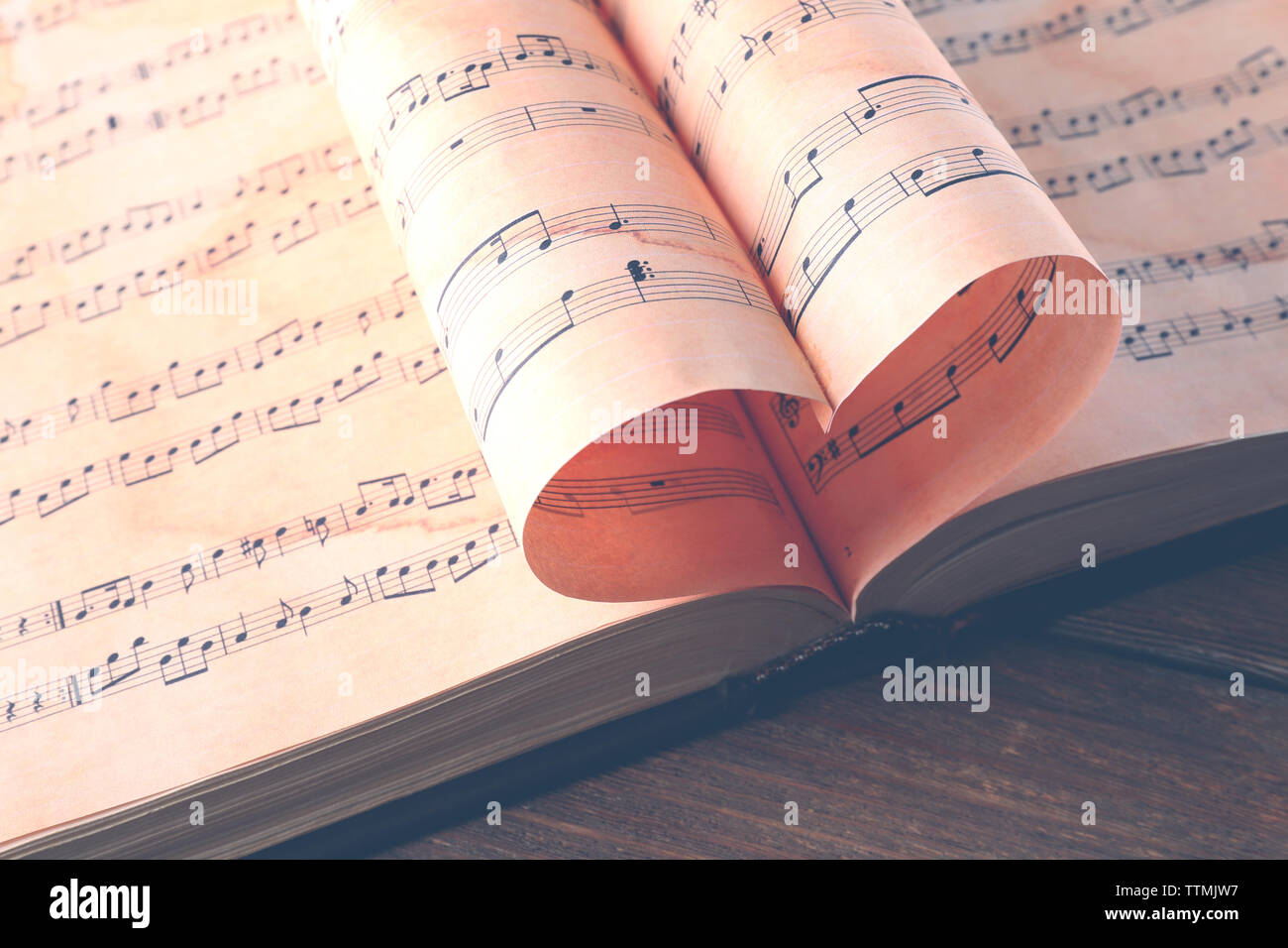 Heart shaped music notes sheets Stock Photo - Alamy