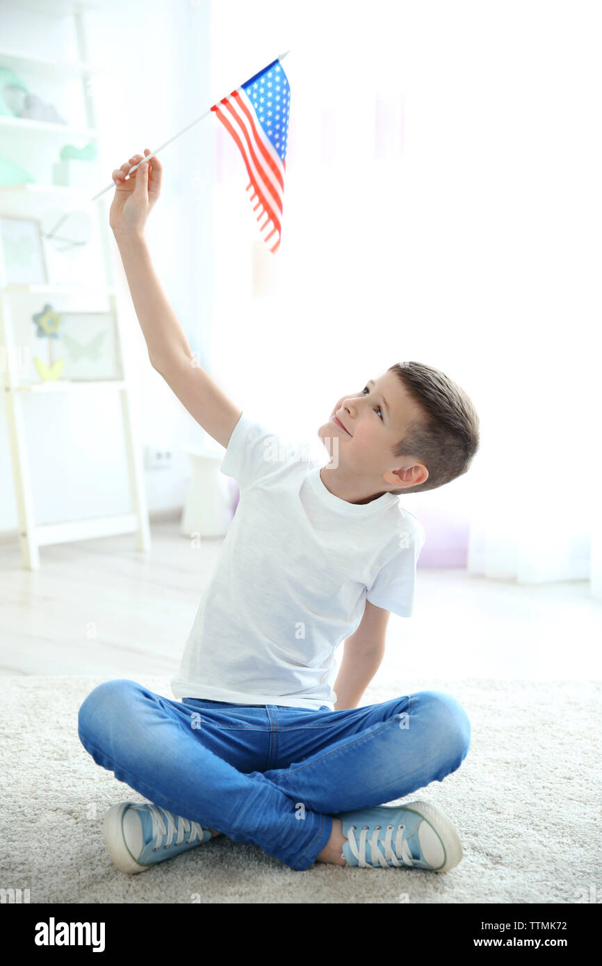 Boy and American flag in room Stock Photo - Alamy