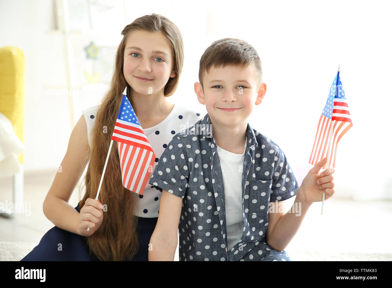 Kids and American flag in room Stock Photo - Alamy