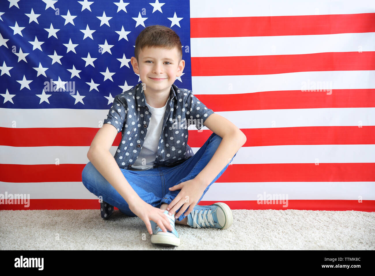 Boy on American flag background Stock Photo - Alamy