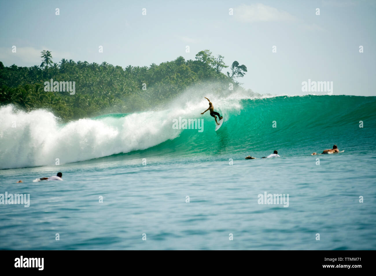 INDONESIA, Mentawai Islands, Kandui Resort, surfer on a wave, Beng Beng ...