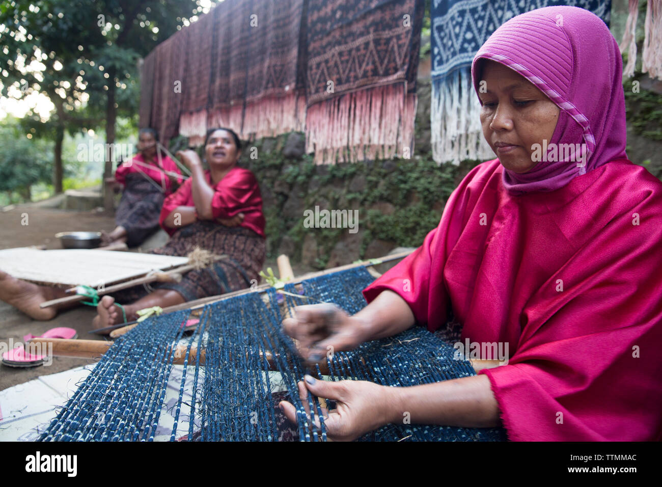 INDONESIA, Flores, women weavers working in the town of Ende, a weaving ...